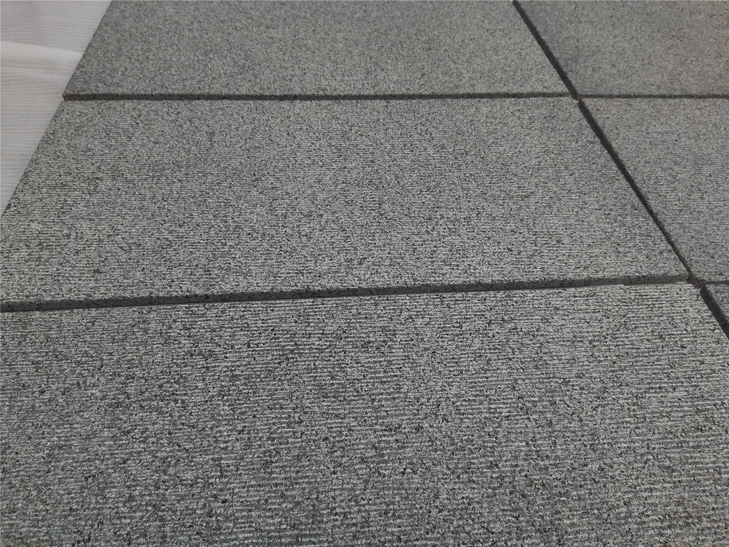 Basalt Dark Combed Basalt Tile | Lowest Price — Stone & Tile Shoppe, Inc.